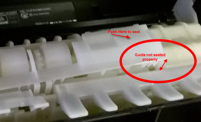 Make sure the paper path guide is properly seated
