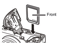 Installing the batteries and memory card into a PowerShot A550, A560 ...