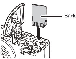 Installing the batteries and memory card into a PowerShot A630 and A640.