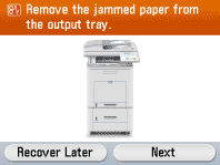 Removing jammed paper from the output tray.
