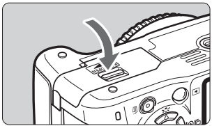 Installing and removing the battery on the EOS Rebel T1i
