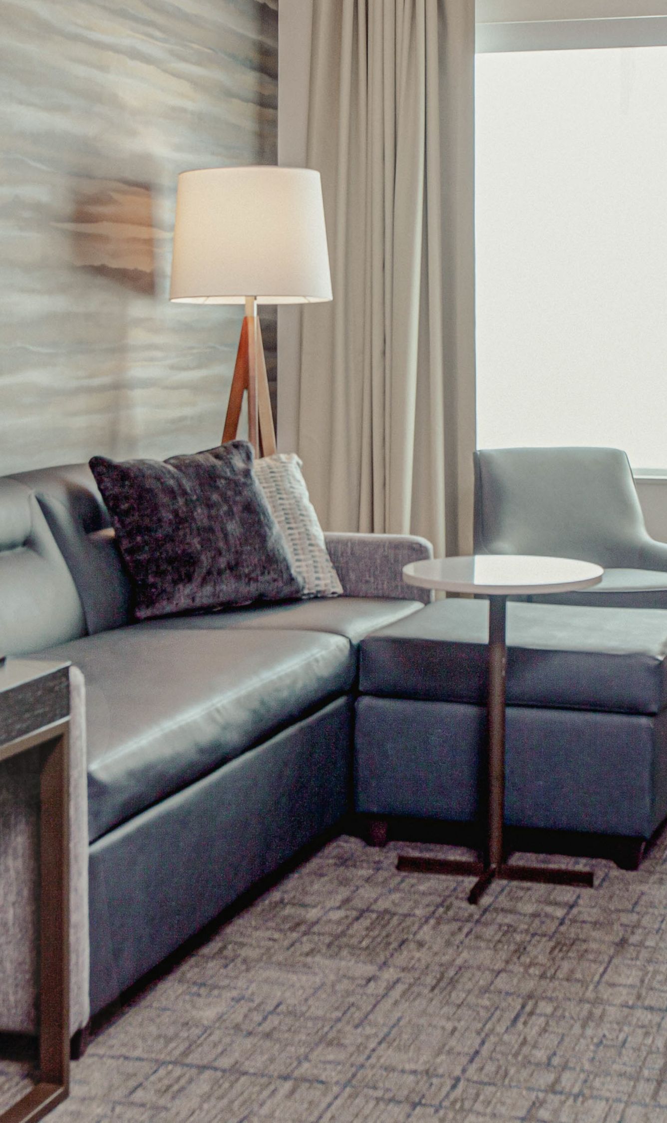 Couch on left wall facing tv and desk.