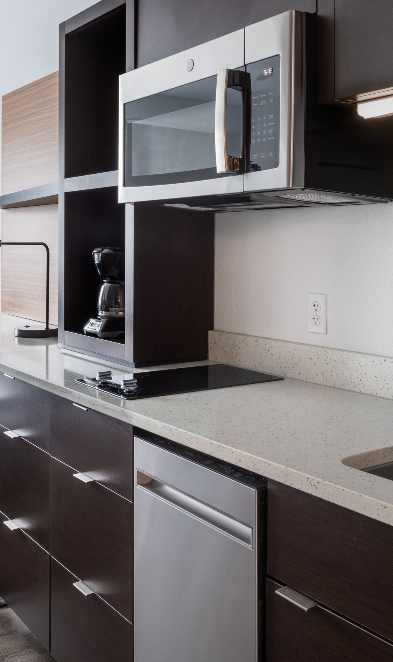 Kitchen with refrigerator, cook top stove